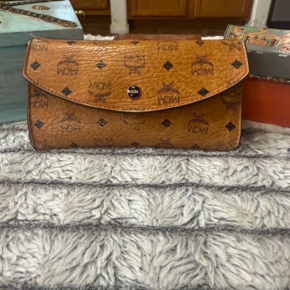 MCM | Bags | Mcm Tan Leather Clutch With Monogram Print | Poshmark